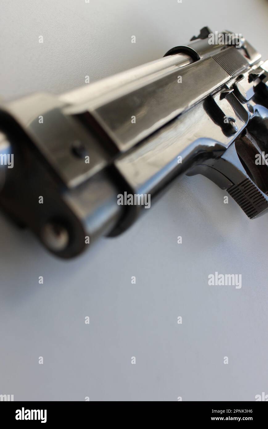 Barrel Of A Handgun On White Surface With Soft Focus Closeup Stock ...
