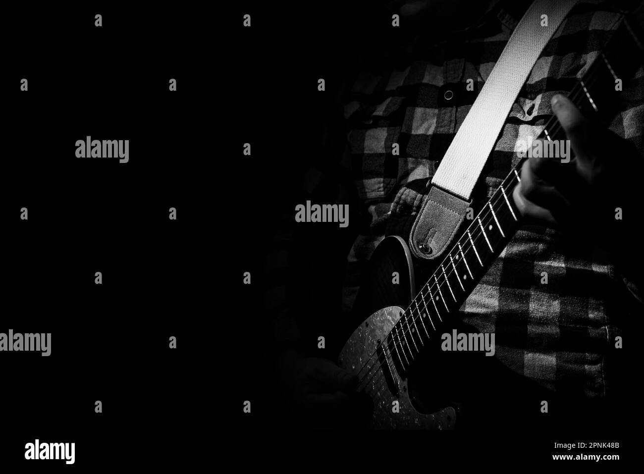 Guitarist on stage for background, soft and blur concept. Close up hand ...