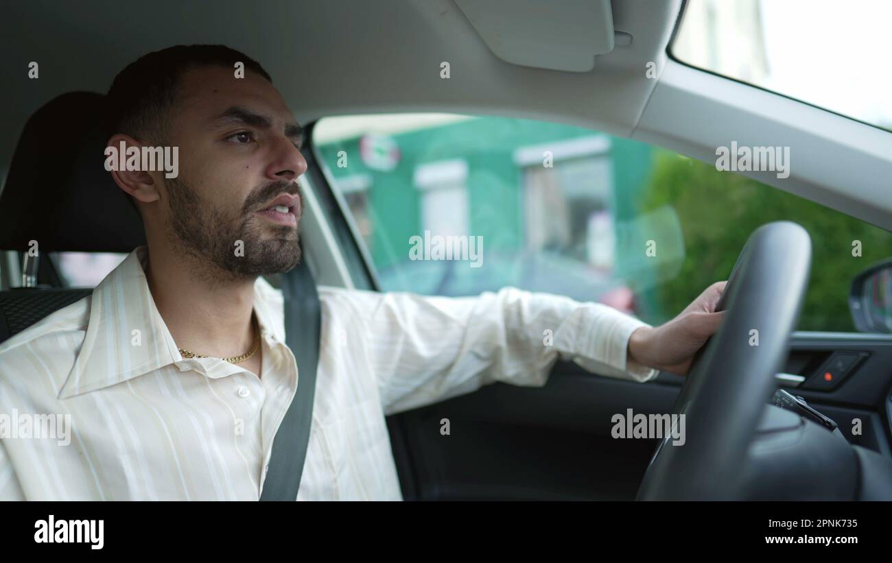 One young Arab man driving car. A Middle Eastern Moroccan male person ...