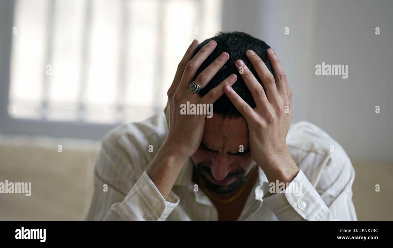 One troubled young man struggling with mental health issues at home ...