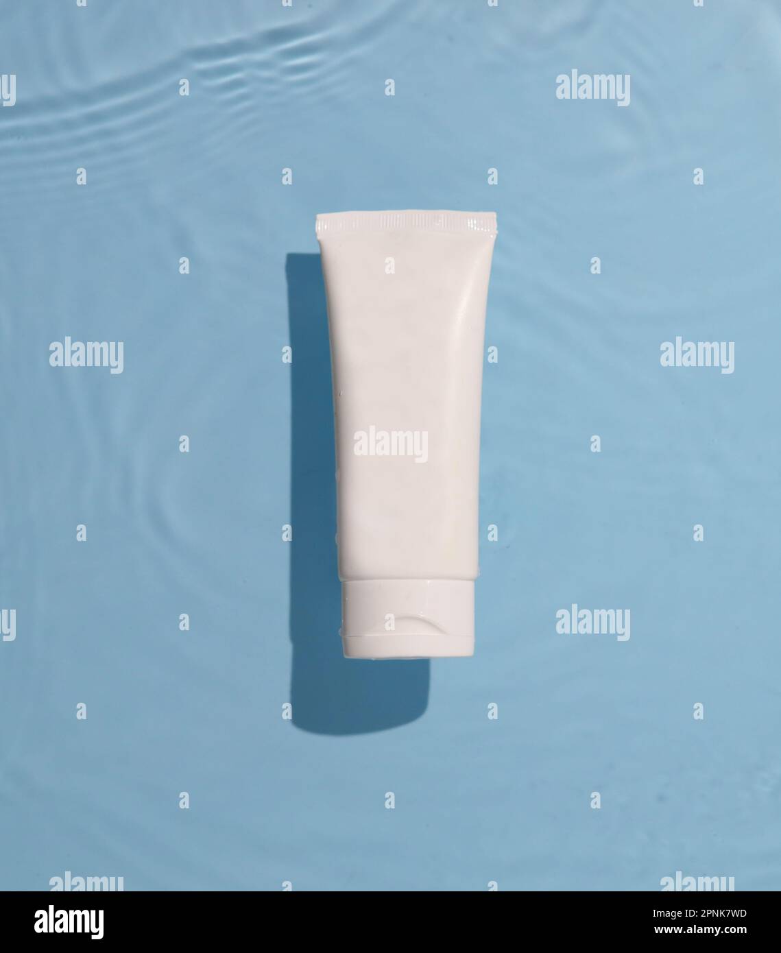 A white toothpaste tube isolated on a light pastel background Stock ...