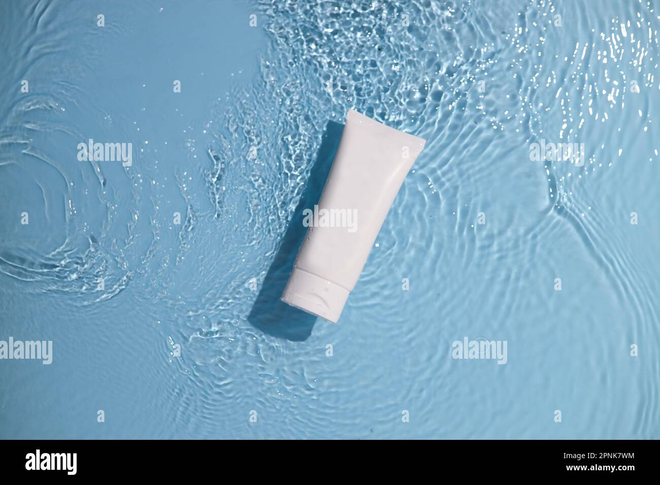 A white toothpaste tube isolated on a light pastel background Stock ...