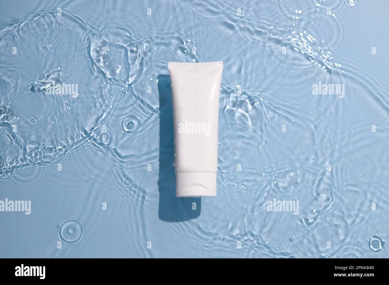 A white toothpaste tube isolated on a light pastel background Stock ...