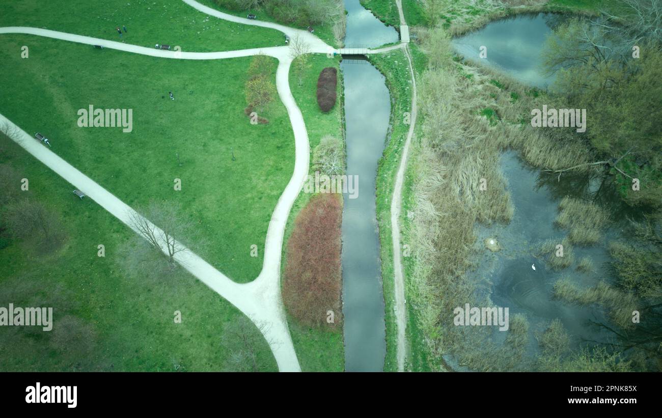 Aerial top down view of spring park landscape with walking paths. drone ...