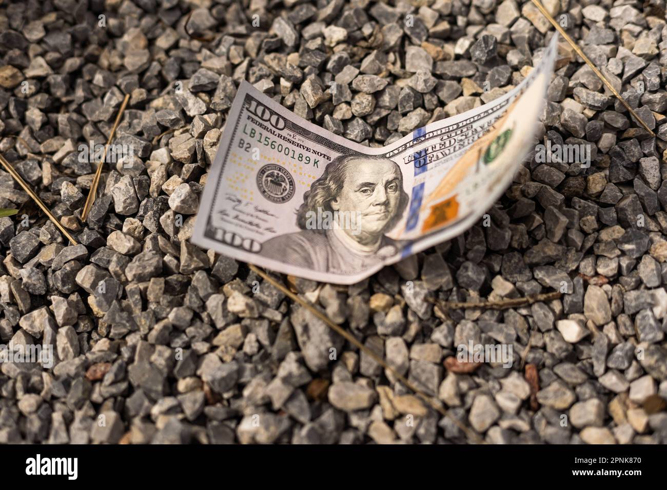 One hundred dollar banknote on the ground. Lost money concept Stock ...