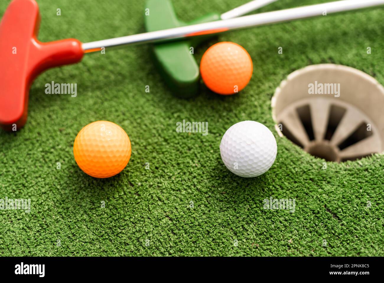 Mini-golf ball on artificial grass. Summer season game Stock Photo - Alamy