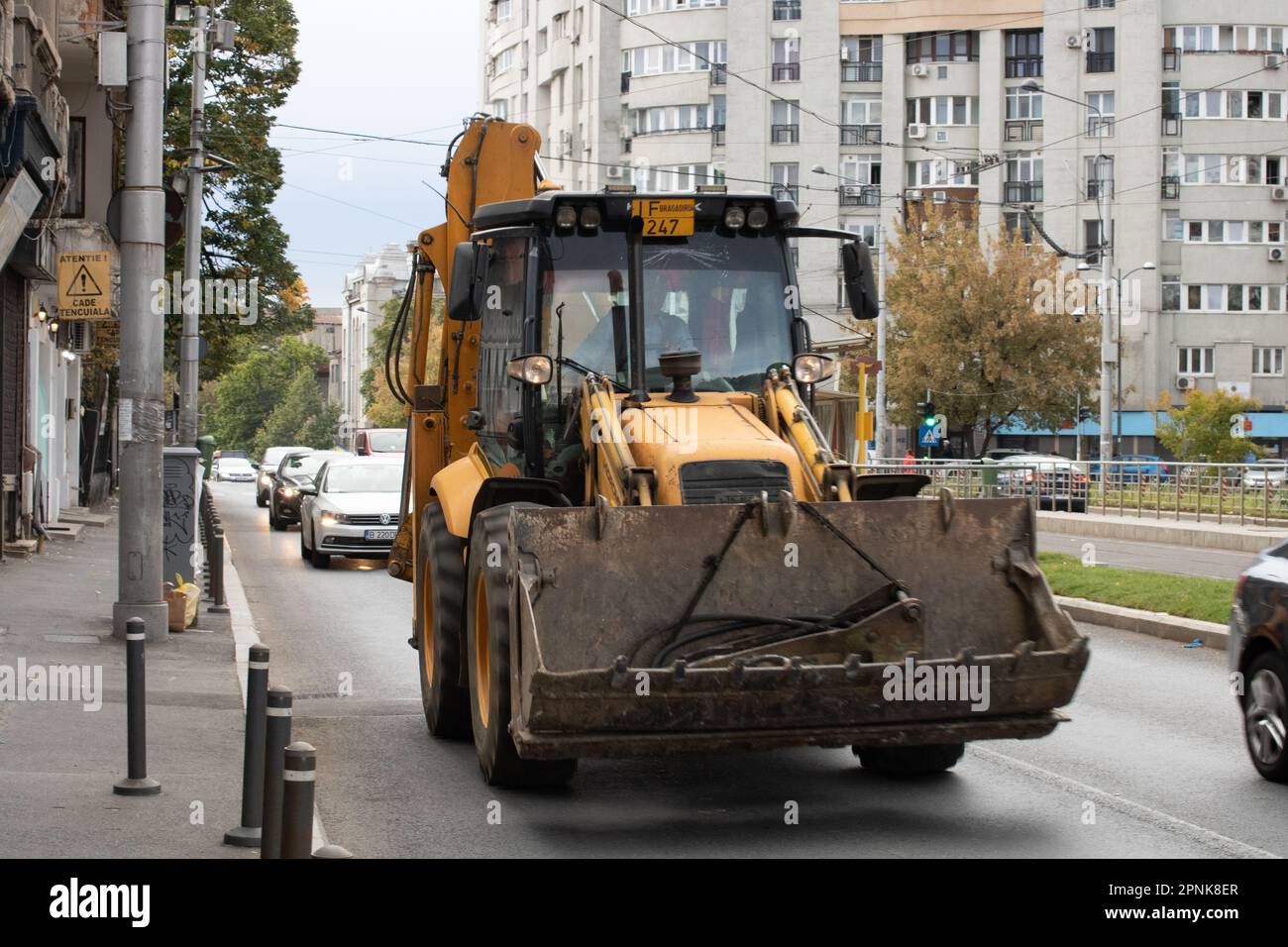 Construction workers at construction site and heavy duty bulldozer in ...