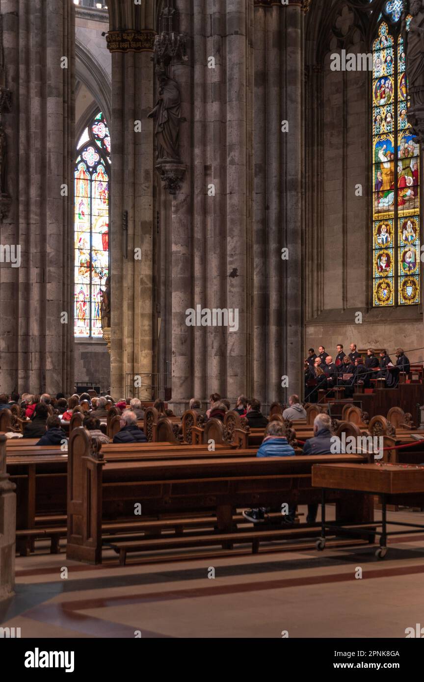 Interior of the Cologne cathedral, Germany during the mass Stock Photo ...