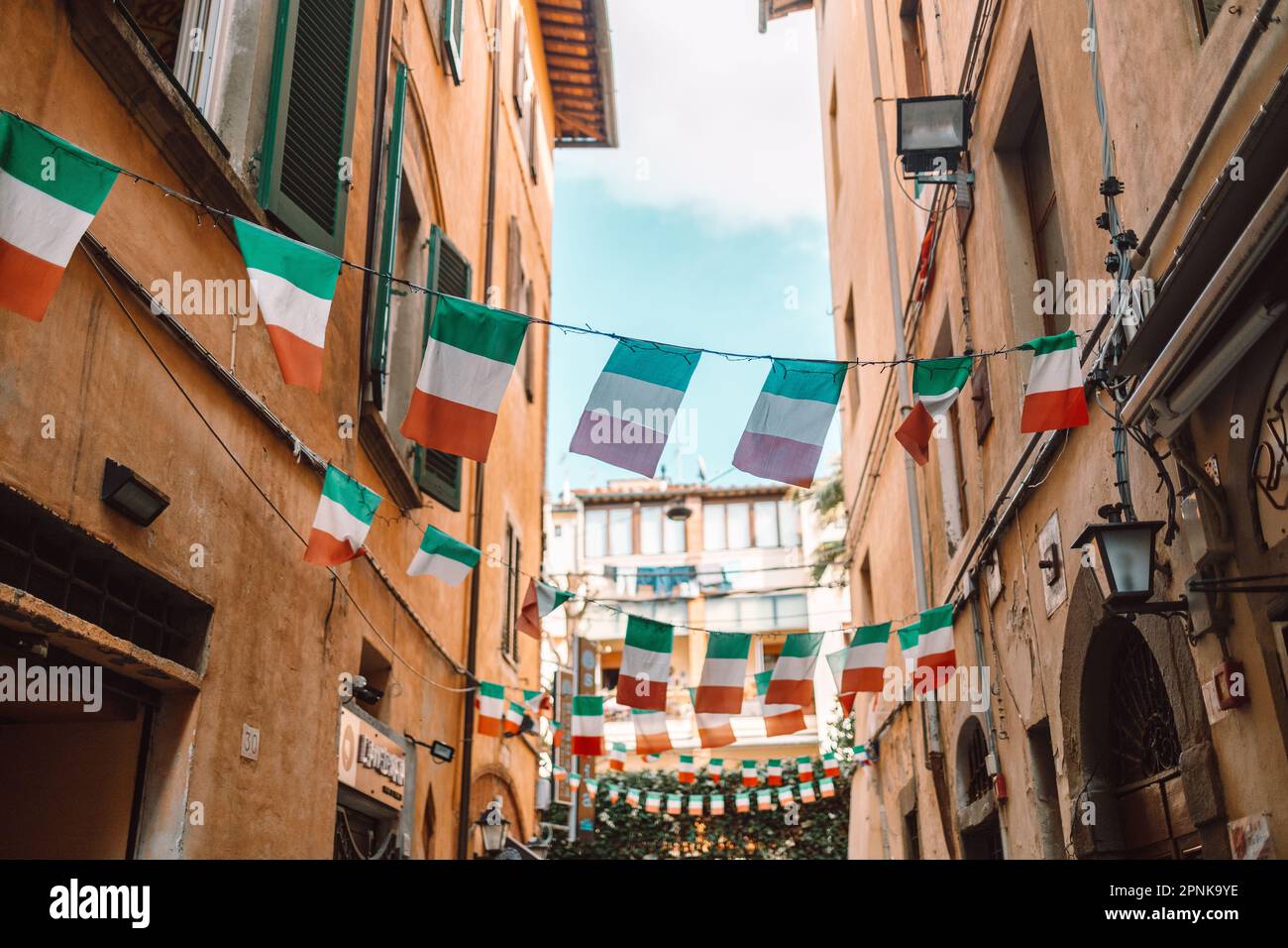 Holiday in the Italian city of streets with Italian flags and ancient ...