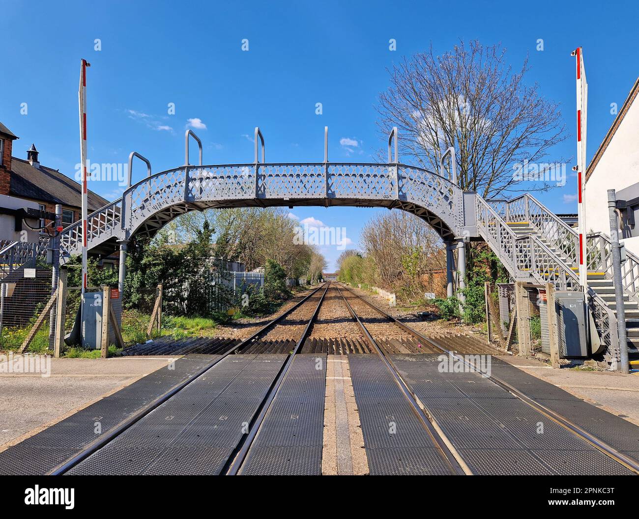 Old wrought iron footbridge over a railway crossing in Long Eaton ...