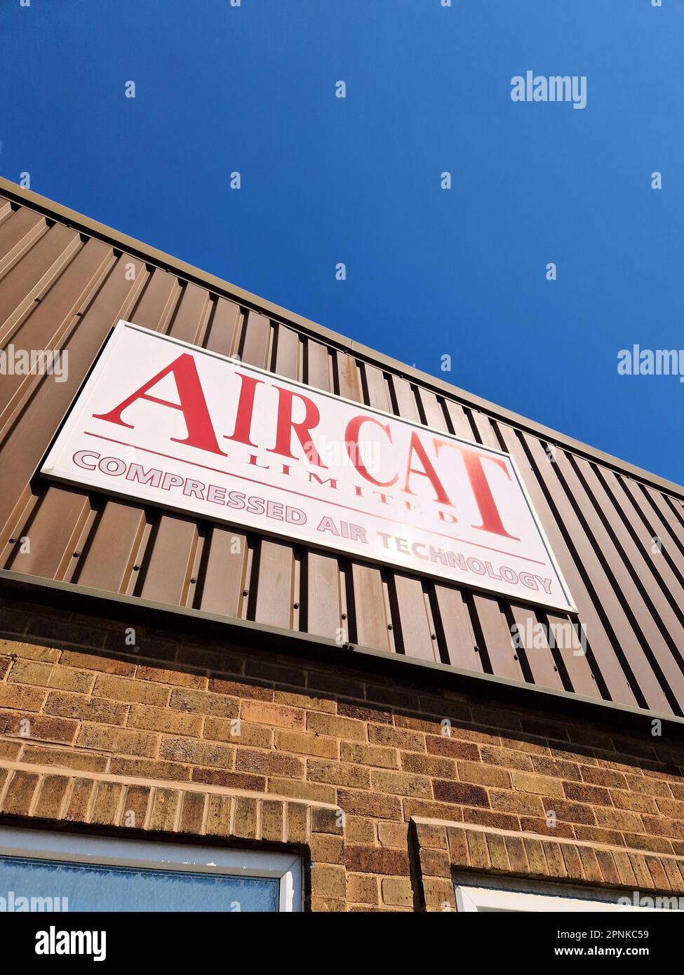 Company business name on a factory wall Stock Photo - Alamy
