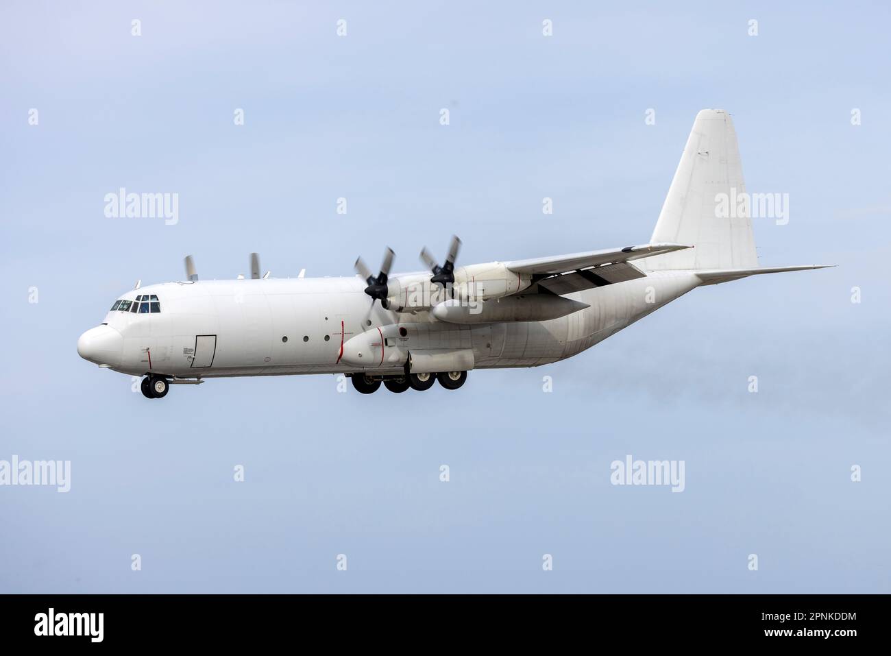 An all white Lockheed L-100-30 Hercules (L-382G) (REG: N2679C) trailing ...