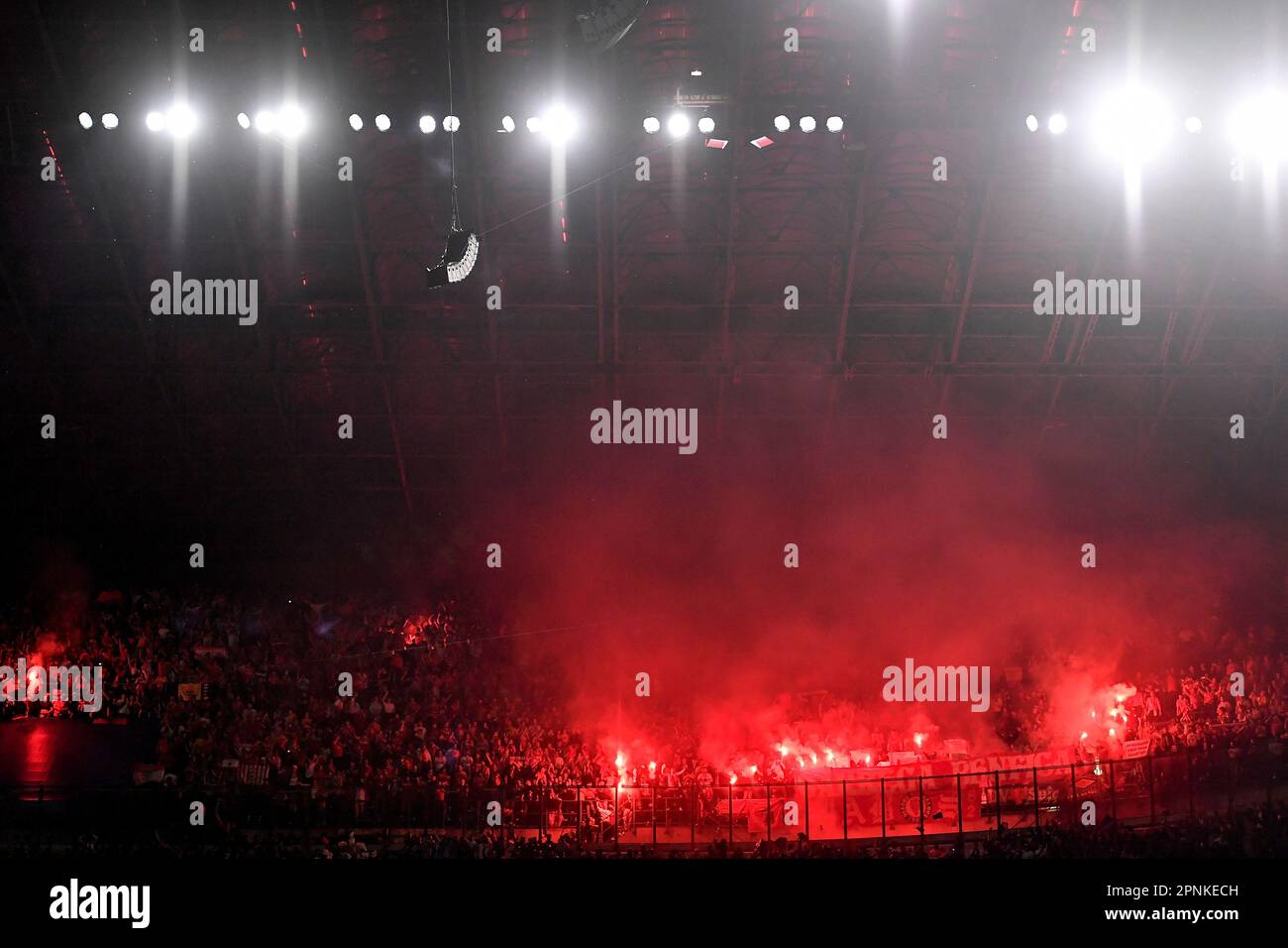 Milan, Italy. 19th Apr, 2023. Benfica fans light flares and smoke bombs ...