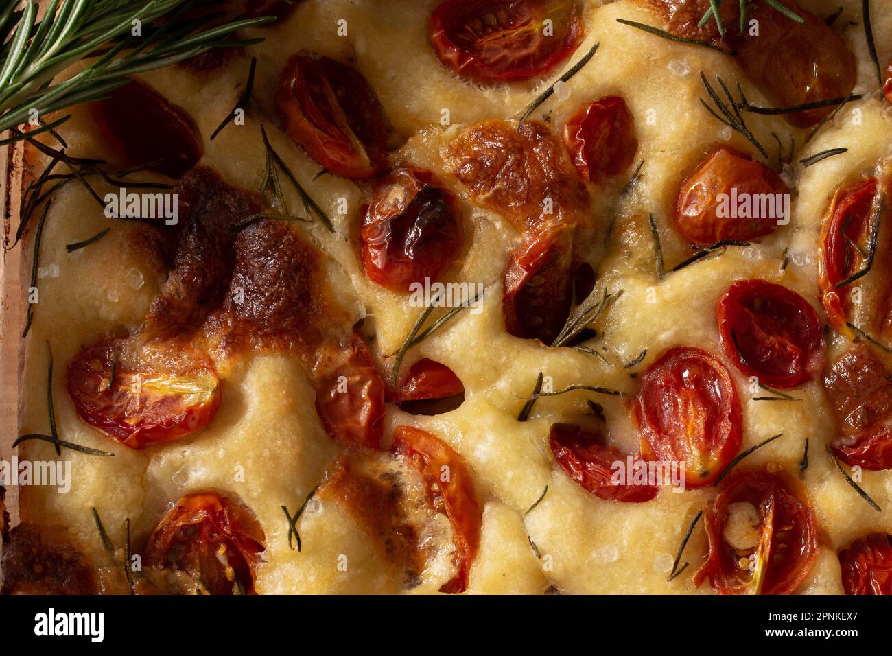 Homemade Italian Pugliese focaccia with rosemary and oil on rustic wood ...