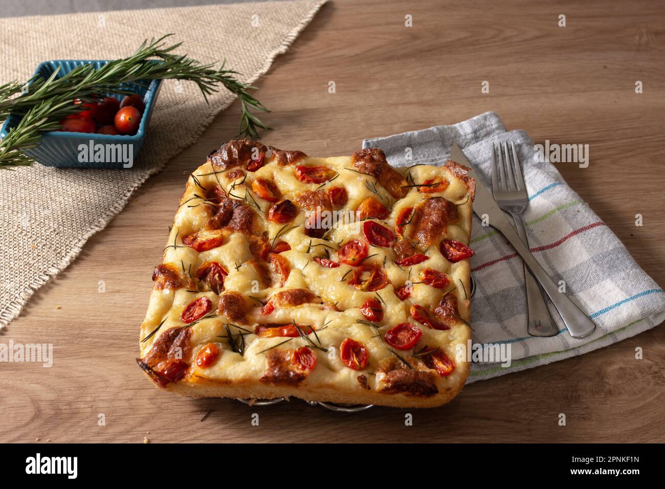 Homemade Italian Pugliese focaccia with rosemary and oil on rustic wood ...