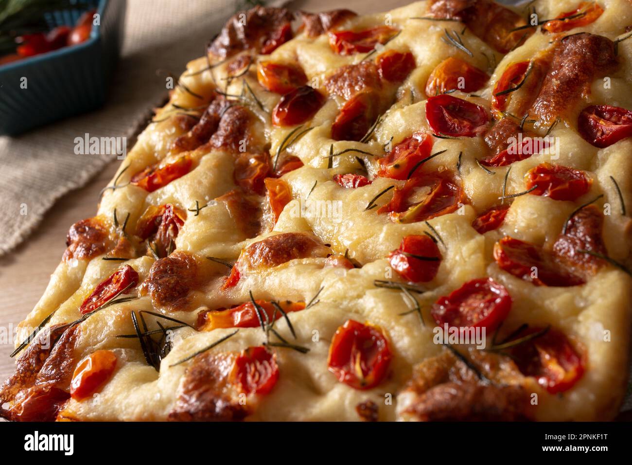 Homemade Italian Pugliese focaccia with rosemary and oil on rustic wood ...