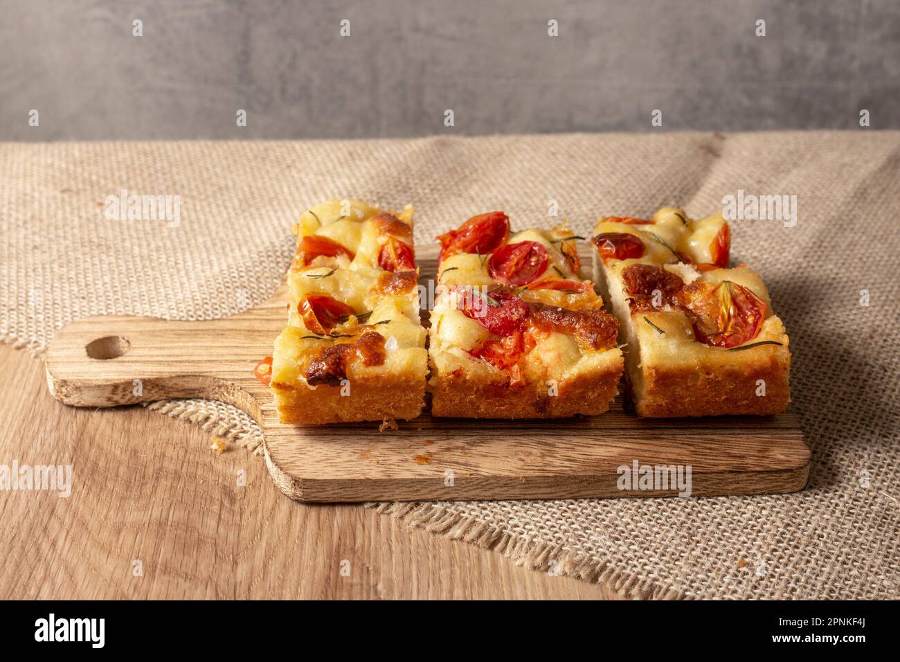 Homemade Italian Pugliese focaccia with rosemary and oil on rustic wood ...