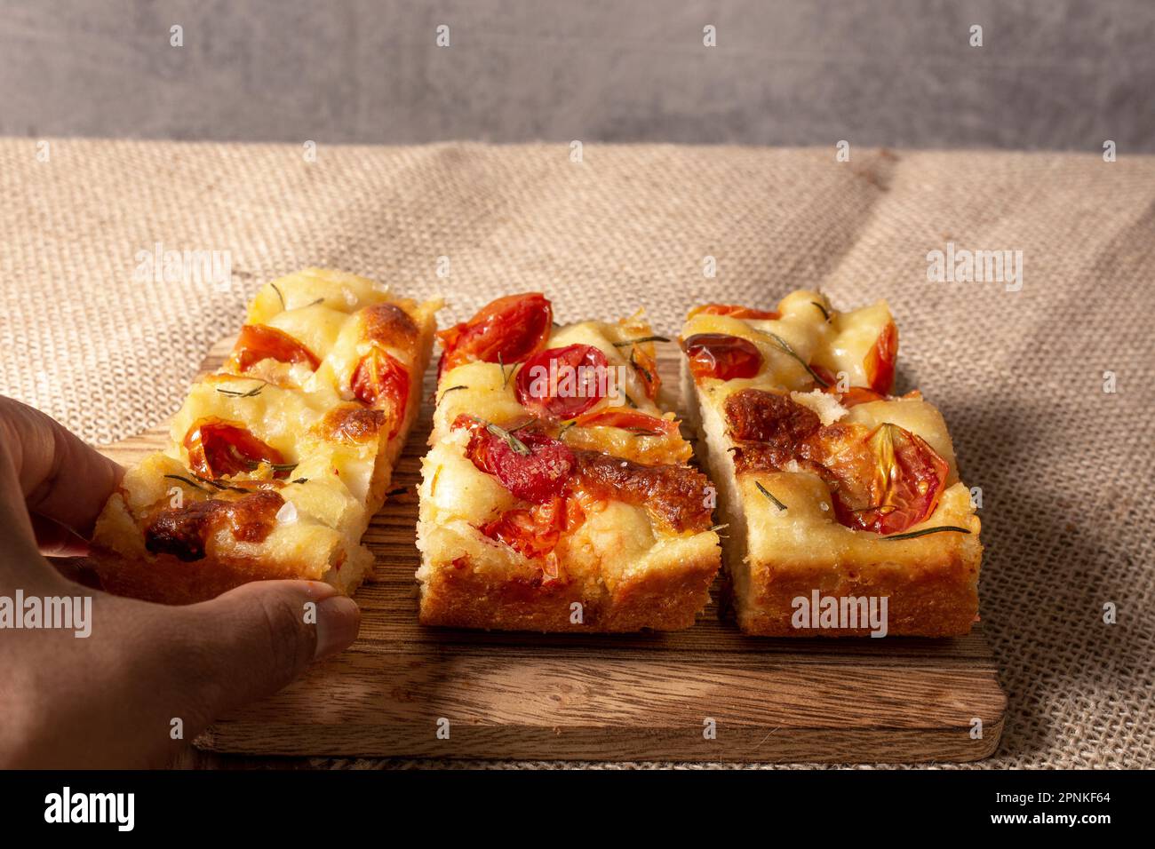 Homemade Italian Pugliese focaccia with rosemary and oil on rustic wood ...