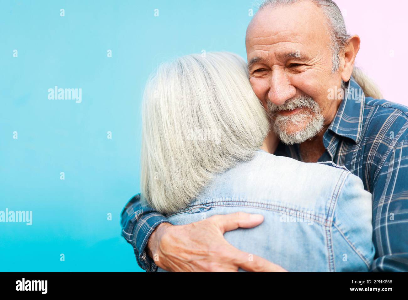 Senior couple hugging each other - Elderly family and friendship ...