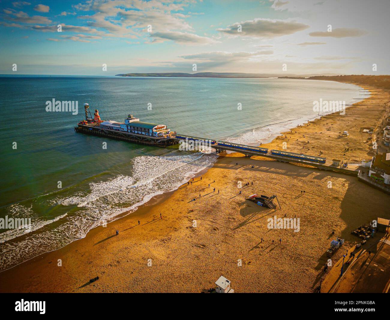 Aerial view of a pier extending out over the ocean Stock Photo - Alamy