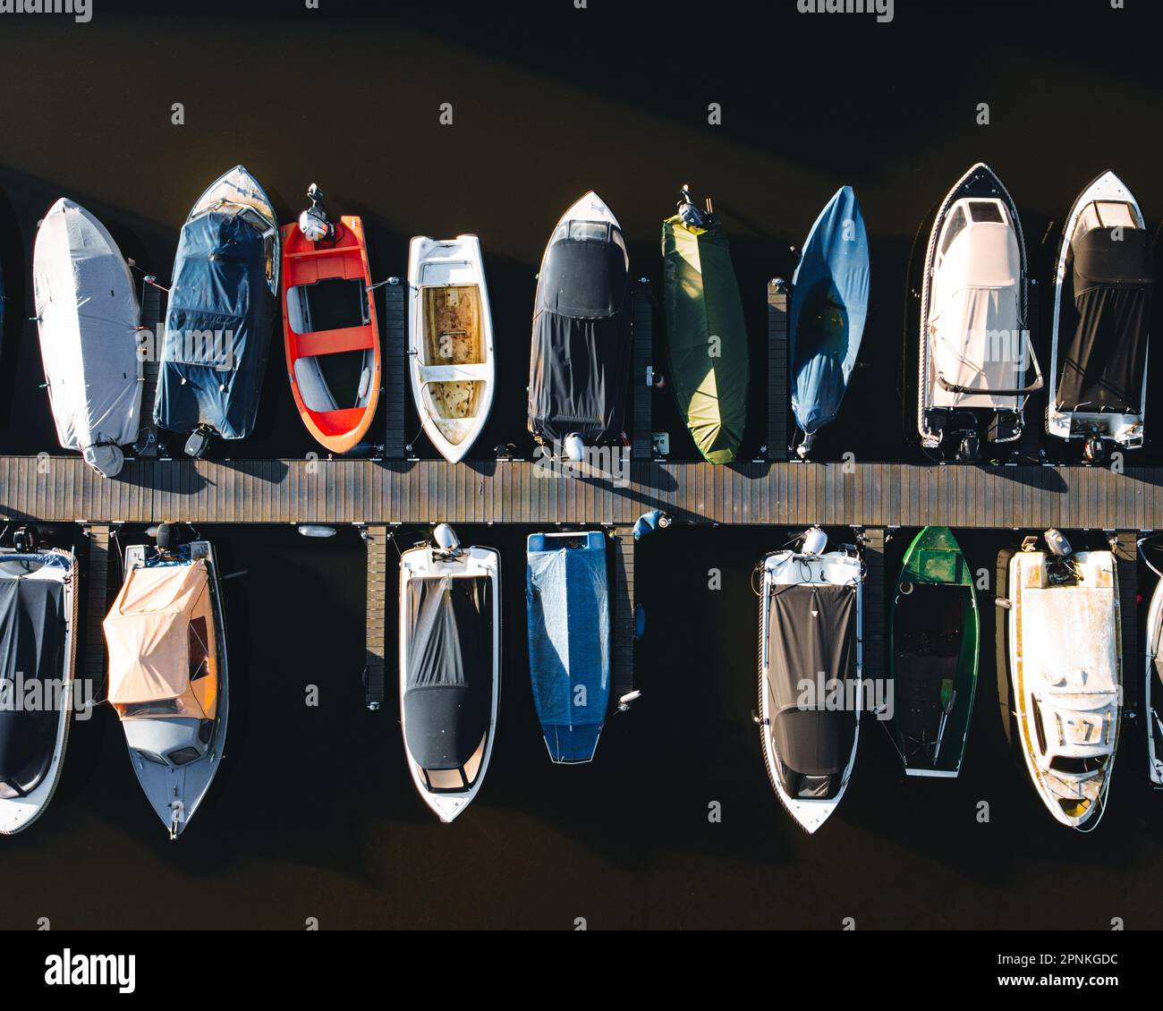 Aerial, top down view of docked boats in a harbour Stock Photo - Alamy