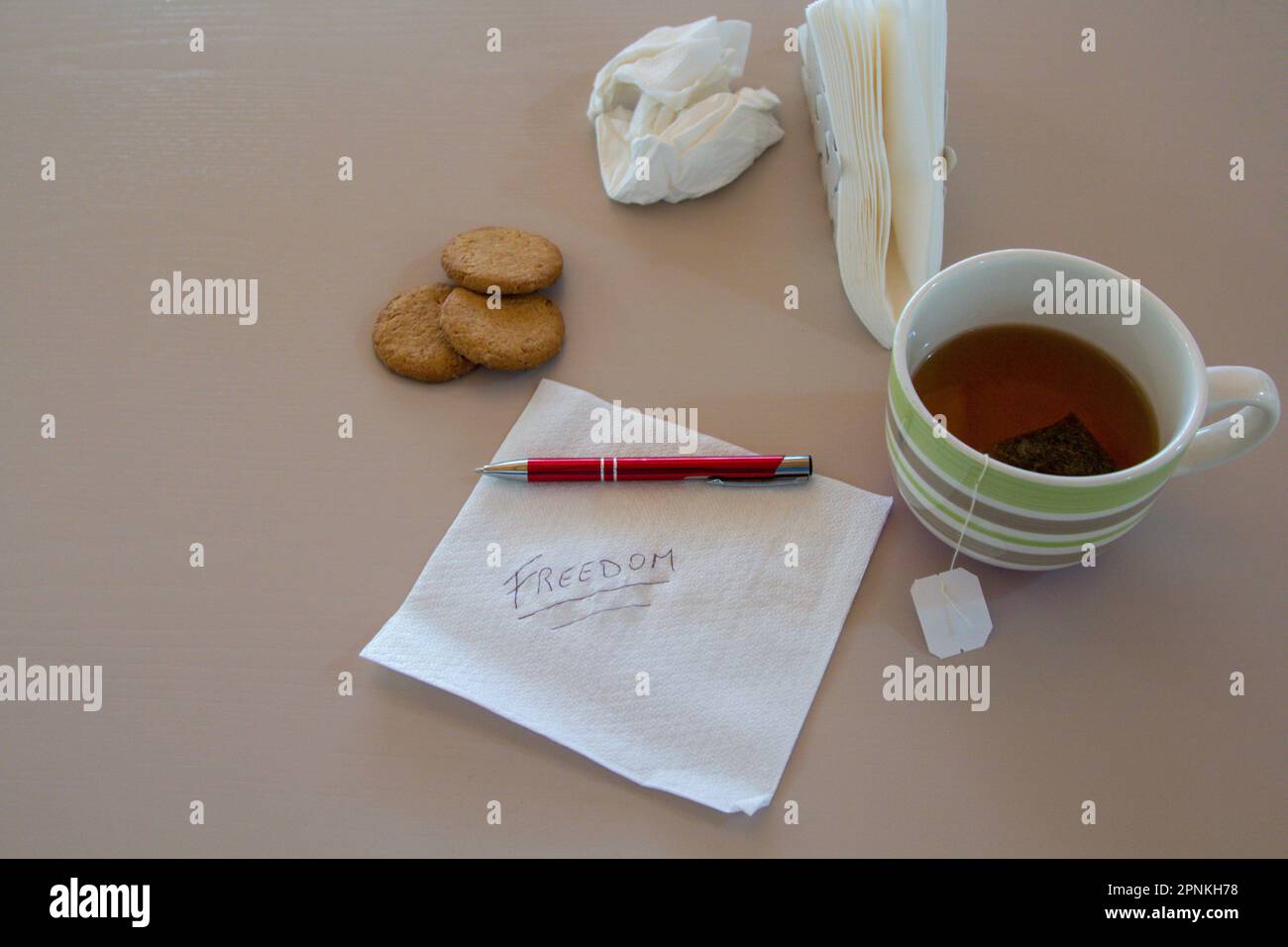 Image of a napkin with freedom written and in the background, a cup of ...