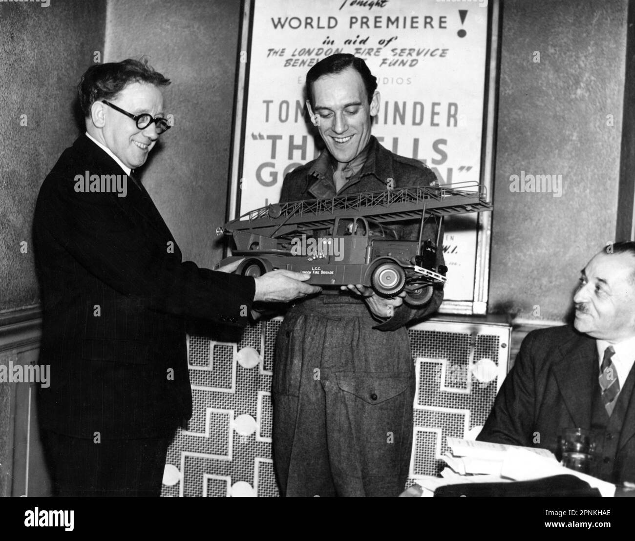 British Home Secretary HERBERT MORRISON and TOMMY TRINDER holding model ...
