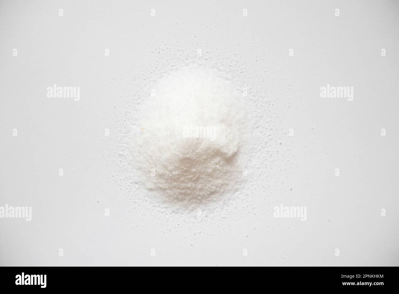 Edible salt on a white background Stock Photo - Alamy