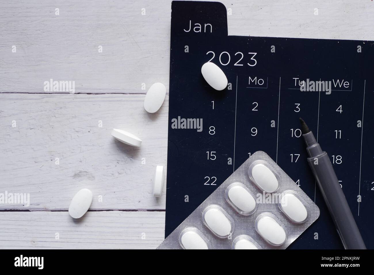 pills of blister pack on calendar Stock Photo - Alamy