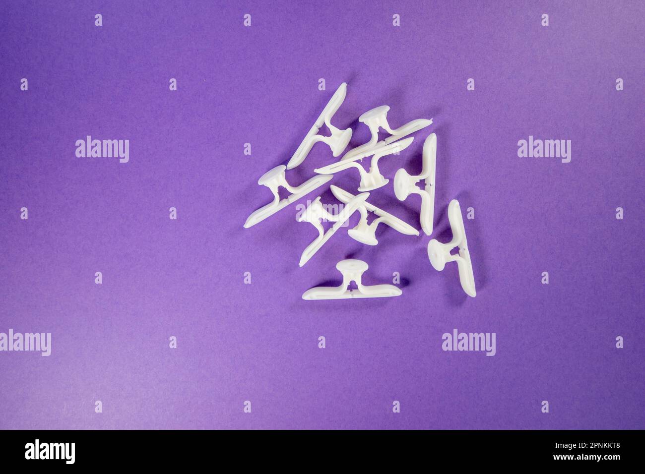 small pile of plastic toggle fixings for plasterboard hollow walls ...