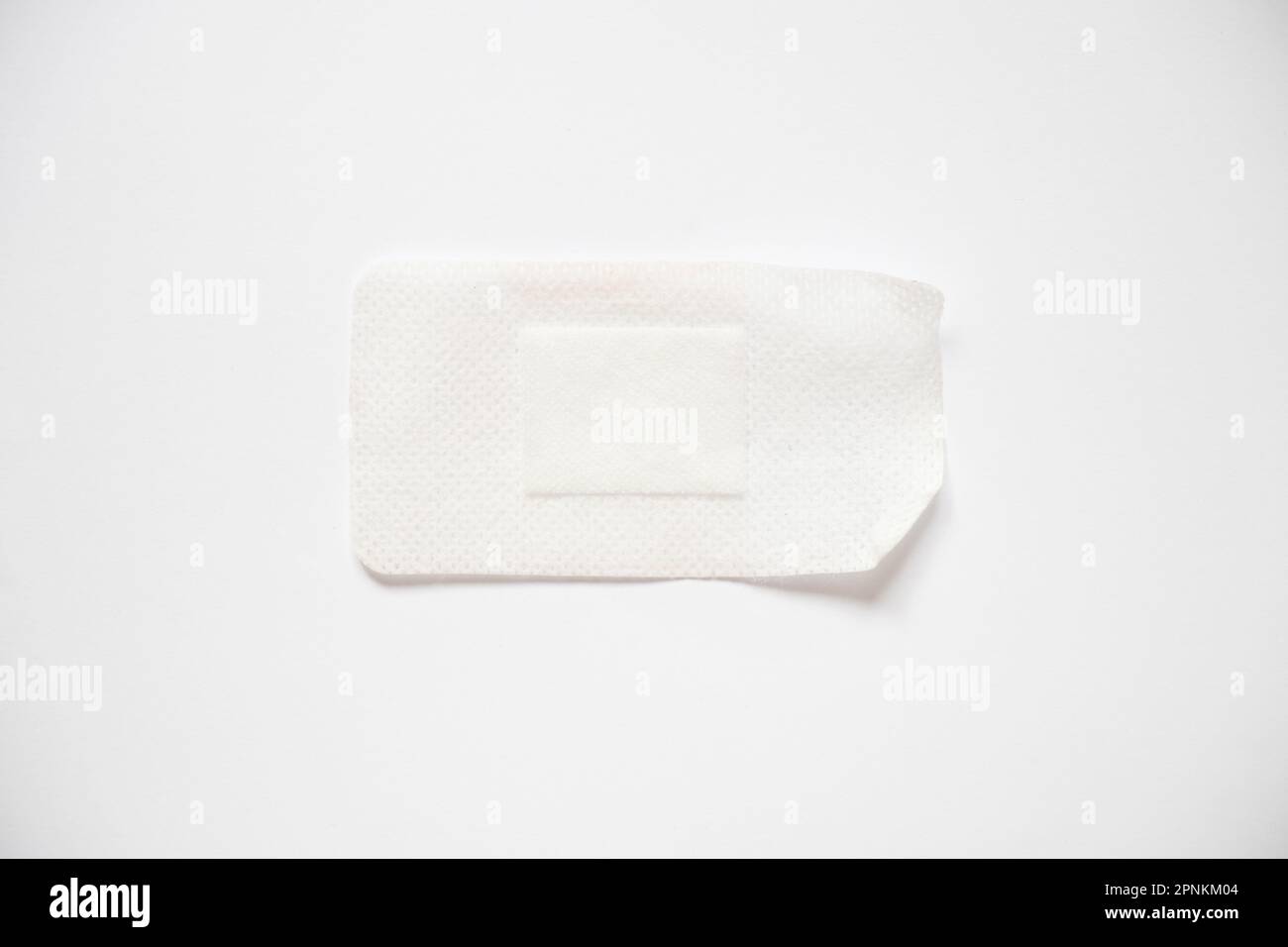 White medical plaster used on a white background Stock Photo - Alamy