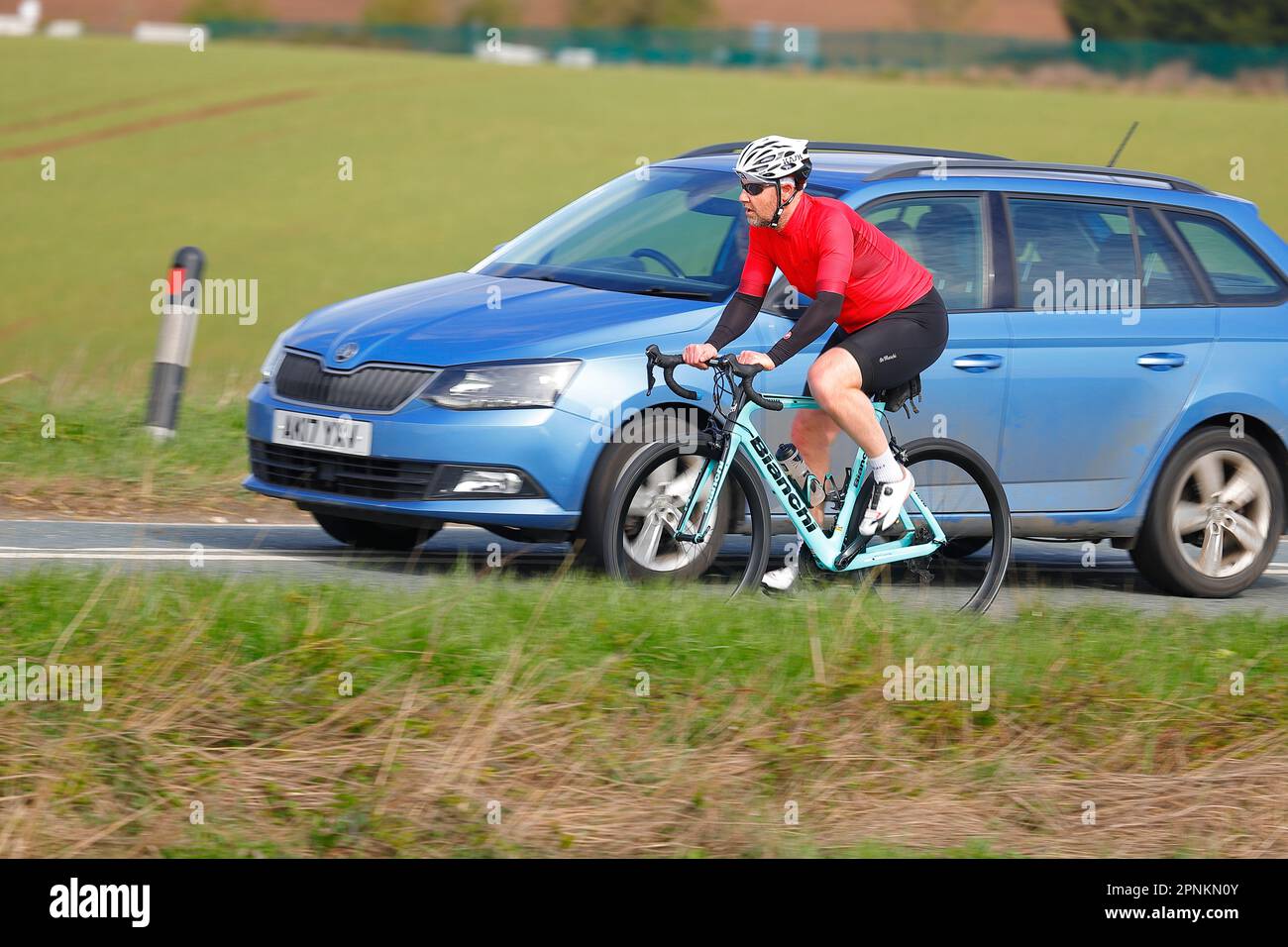 A cyclist being overtaken by a motorvehicle on the B1222 near Sherburn ...