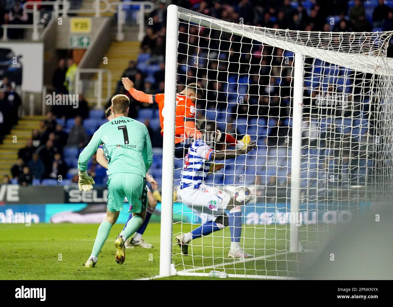 Reading goalkeeper Joe Lumley is left stranded as Luton Town's Carlton ...