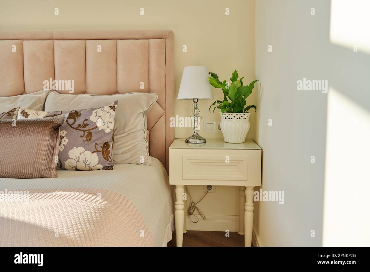 Classic bedroom interior in light ivory colors, in warm sunlight Stock ...