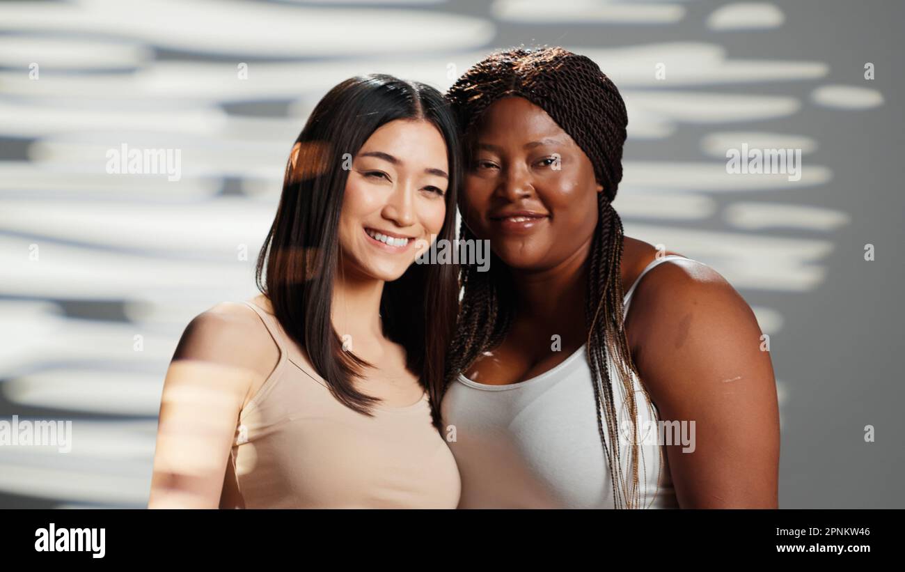 Confident women advertising self love and bodycare, hugging each other ...
