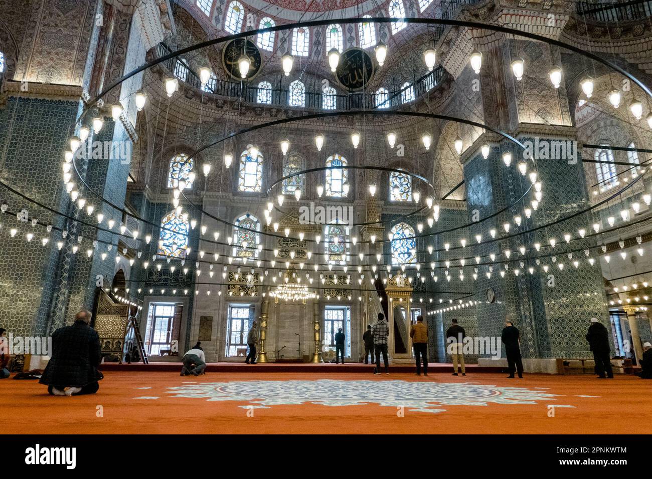 People pray inside The Yeni Mosque, also known as the New Mosque, a ...