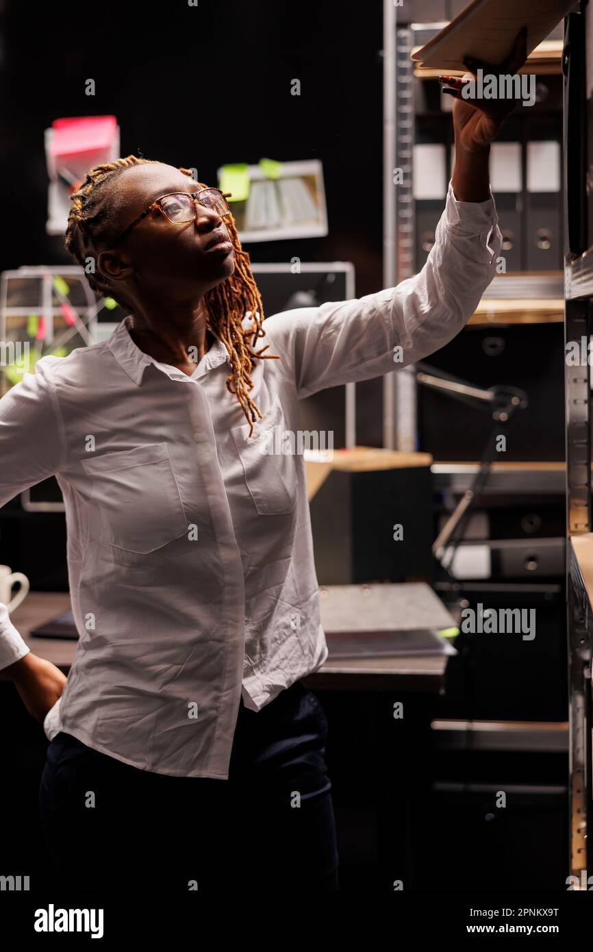 Private detective studying crime case hi-res stock photography and ...