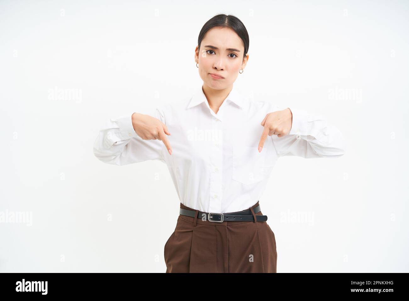Disappointed lady boss, young woman points down with concerned ...