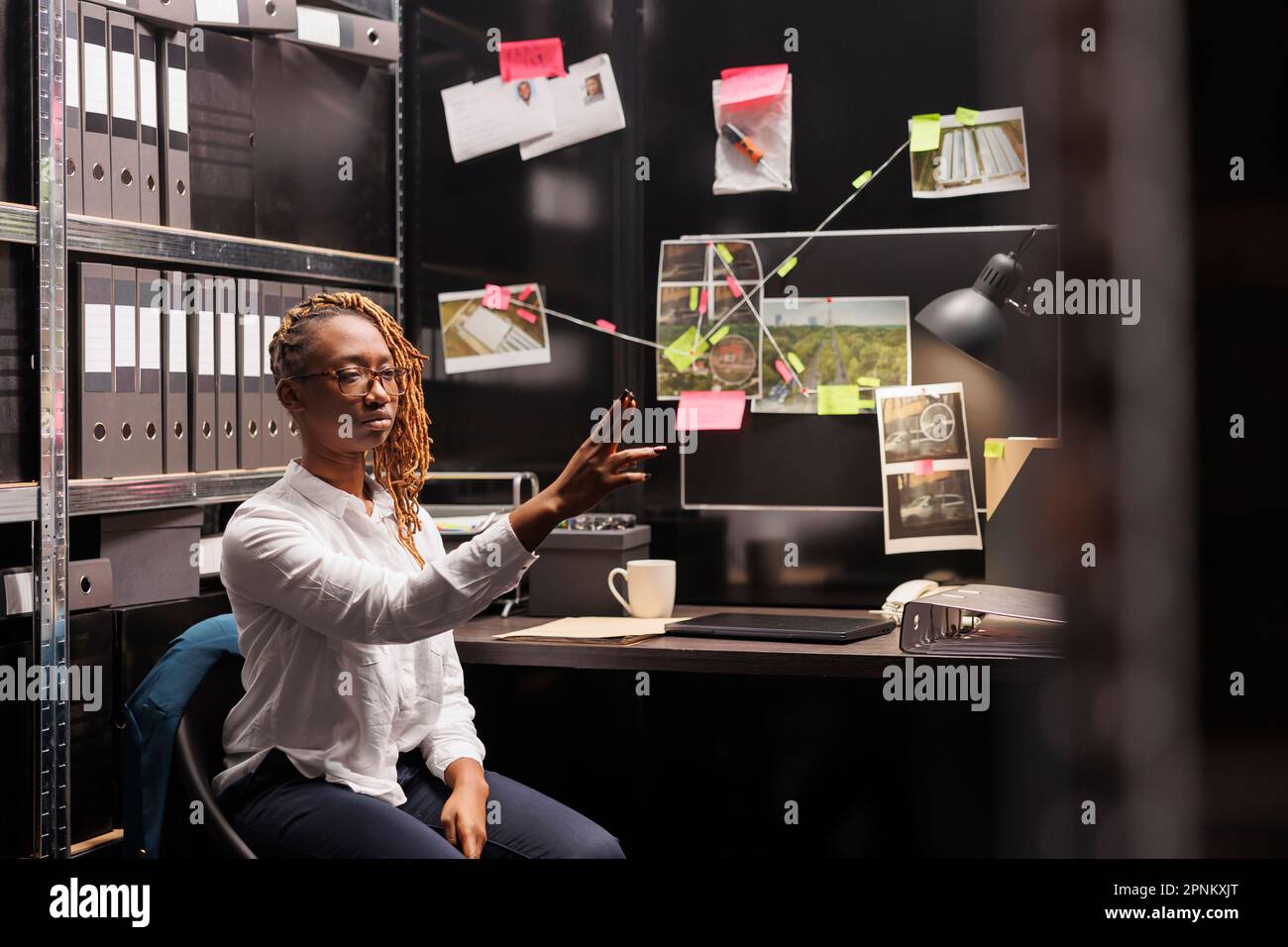 African american woman detective using ar technology in investigation ...