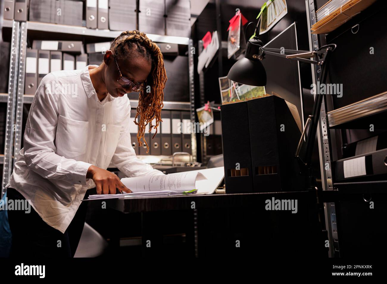 Woman detective reading crime case file, analyzing witness testimony ...