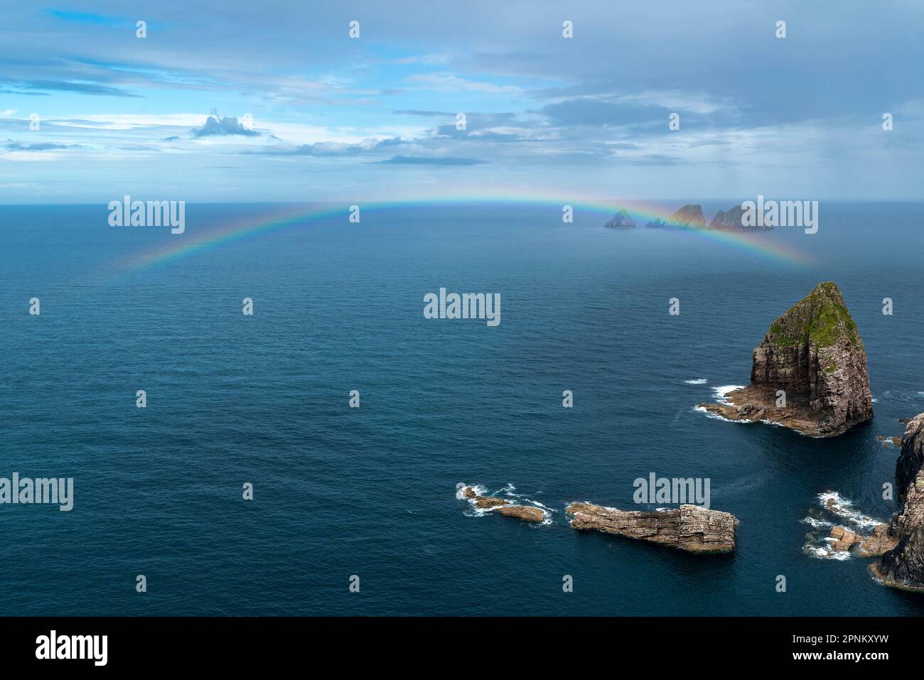 Scenic view of the Atlantic Ocean under a beautiful rainbow at Benwee ...