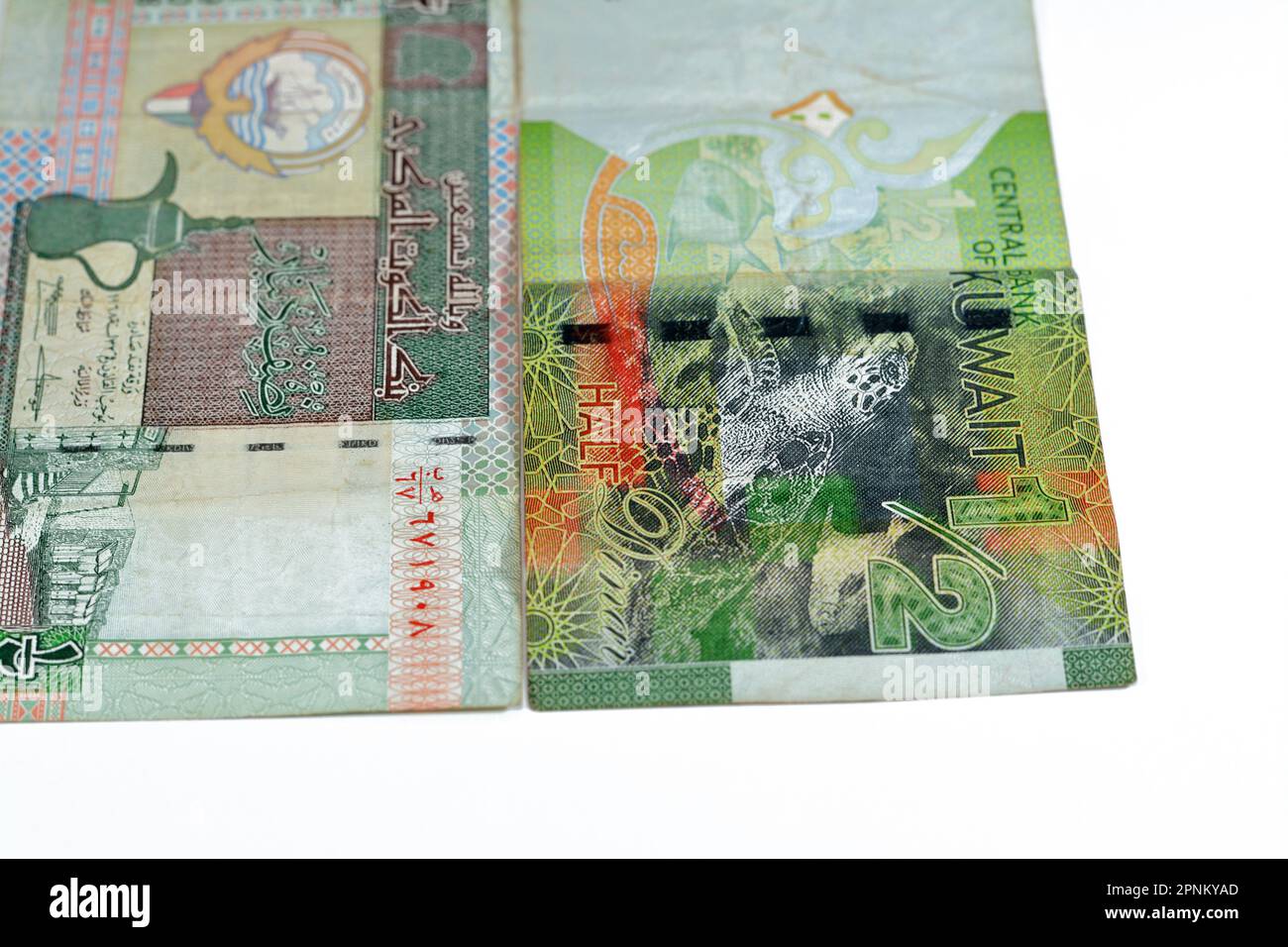 Old and new Kuwaiti half dinar bill banknotes money coat of arms of ...