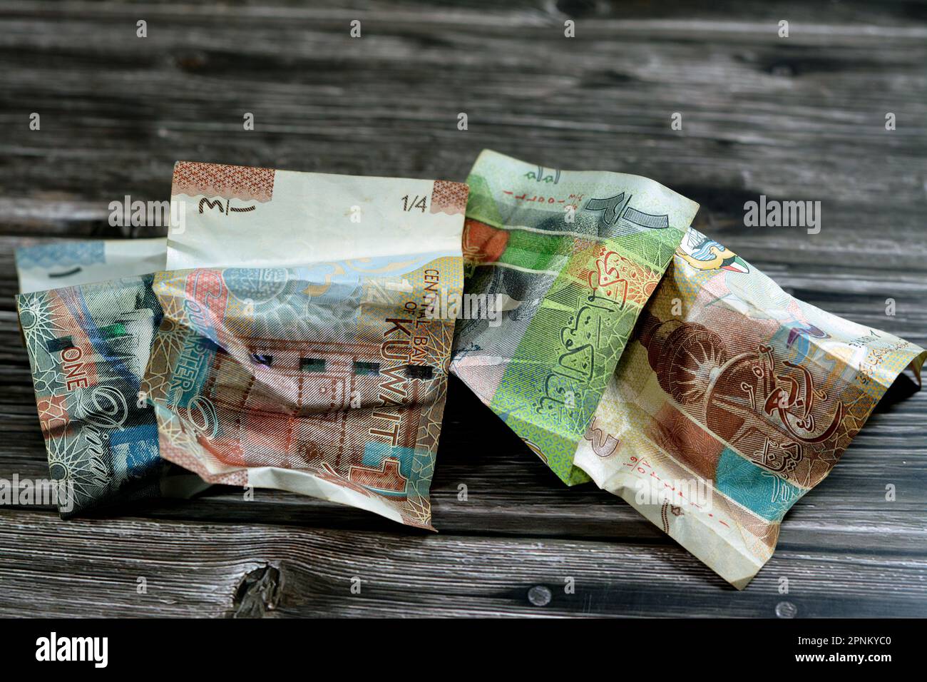 crumpled Kuwaiti money of quarter, half and one KWD Kuwait dinar bills ...