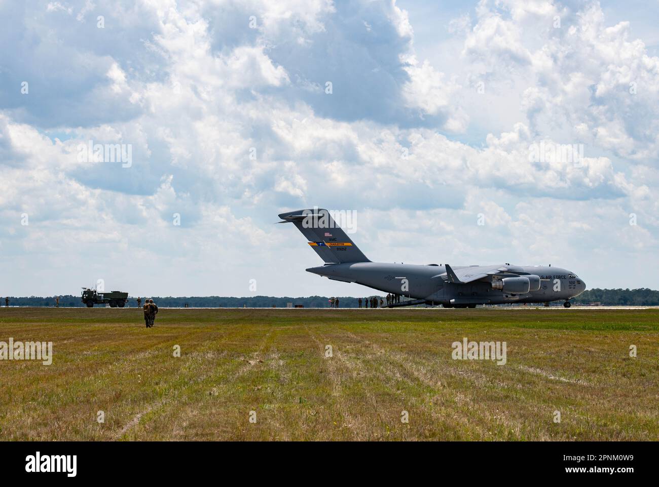 U.S. Marines assigned to the 2nd Battalion, 10th Marines, load a High ...