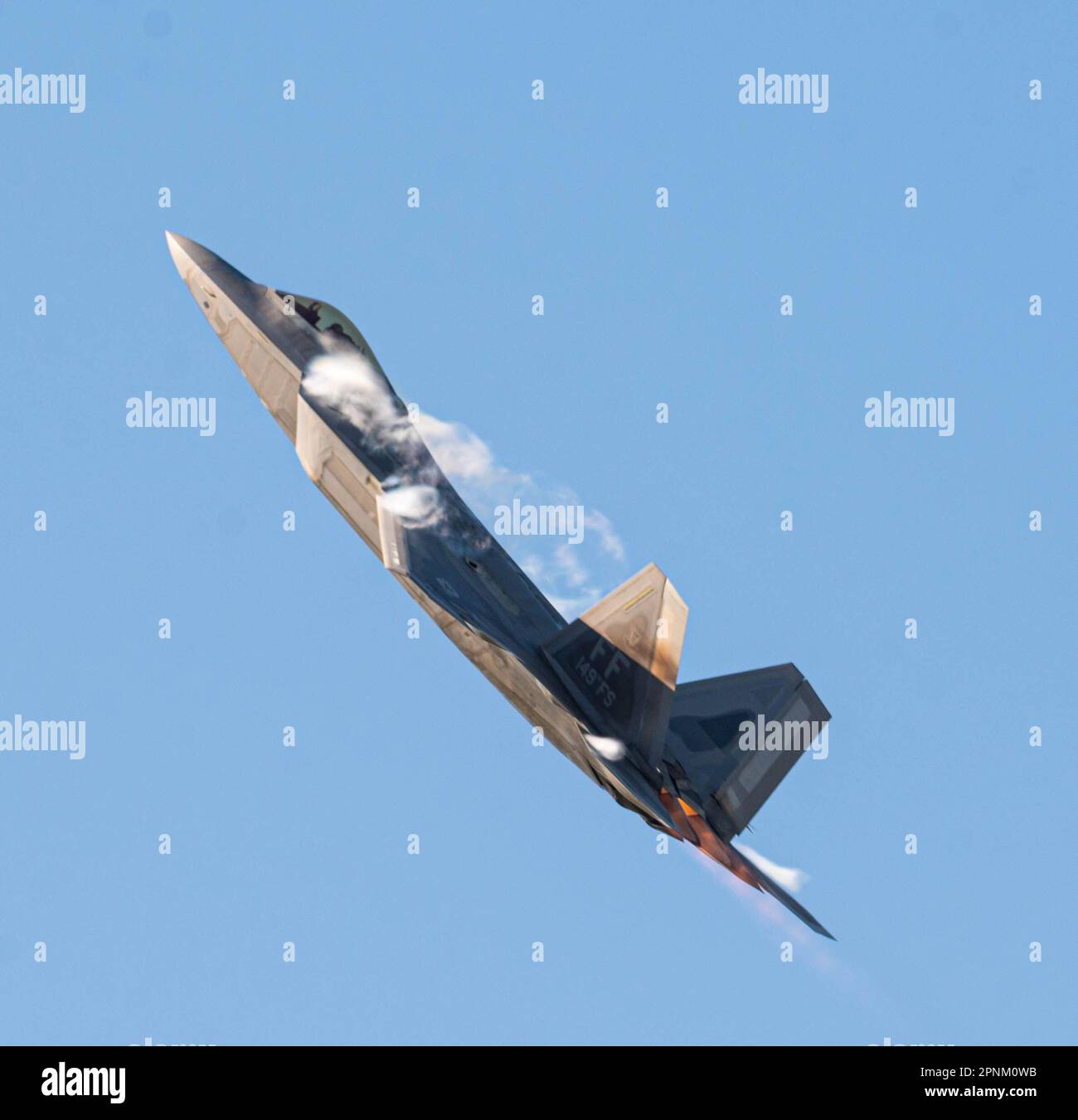 U.S. Air Force Capt. Samuel “RaZZ” Larson, F-22 Raptor Demonstration team commander, performs a ...