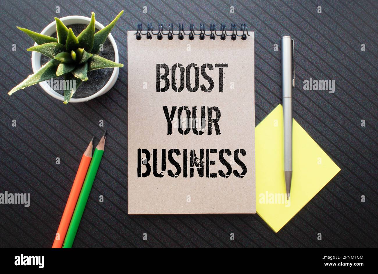 Boost Your Business text on notepad, concept background Stock Photo - Alamy