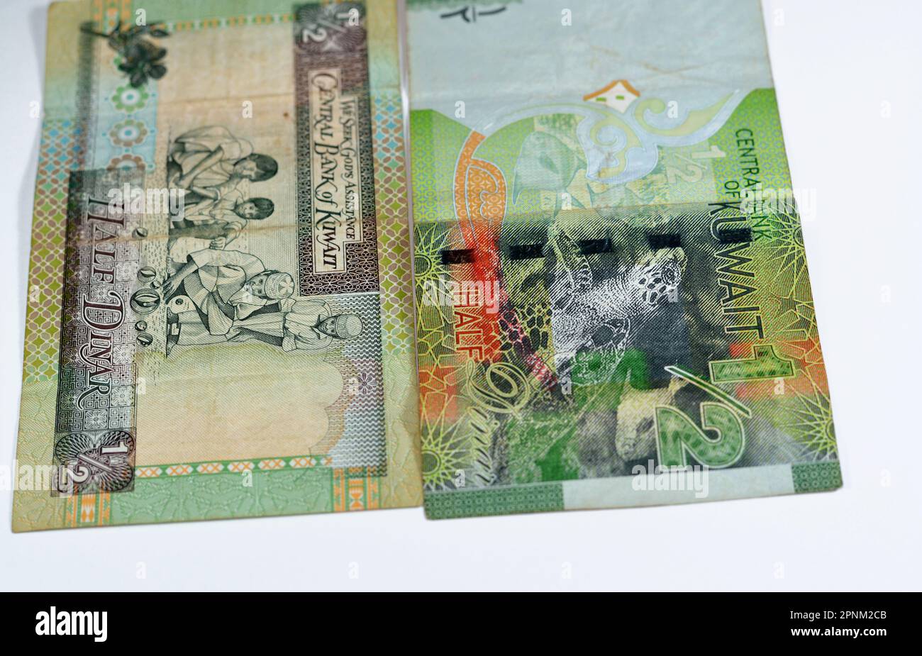 Old and new Kuwaiti half dinar bill banknotes money coat of arms of ...