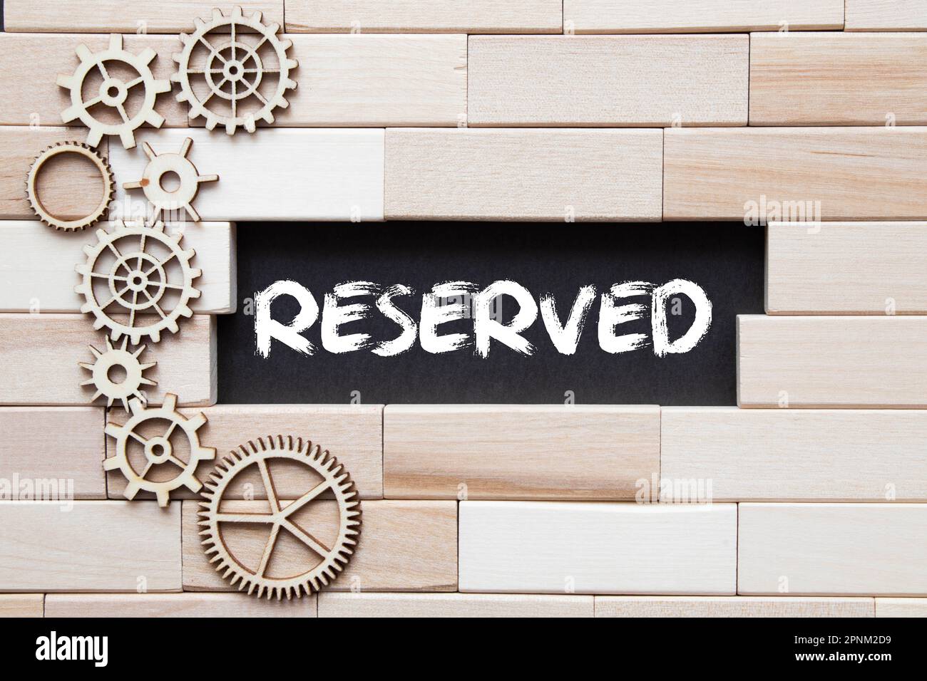 Yellow note paper with word reserved on cork board background with copy ...