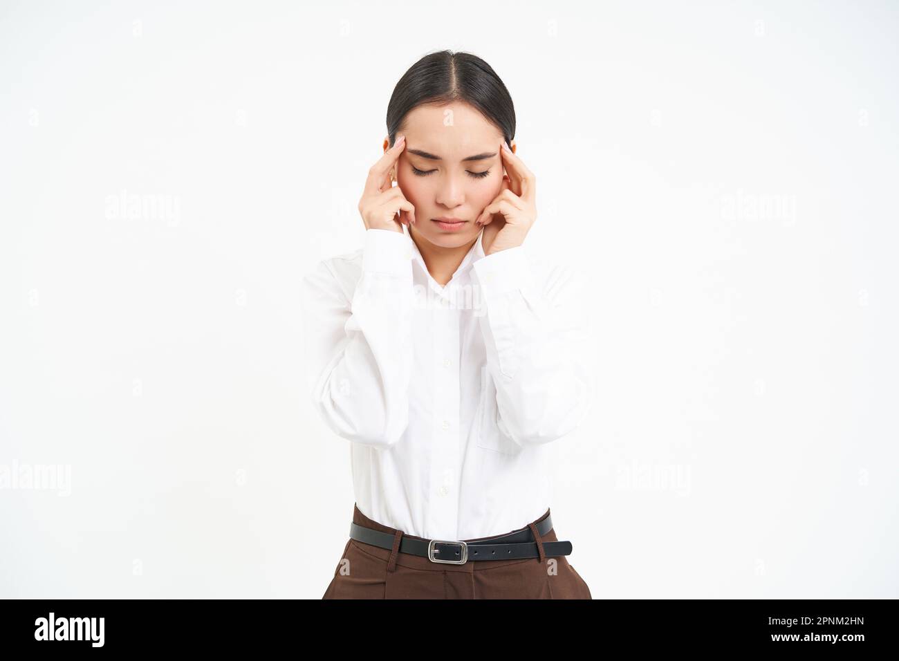 Tired corporate woman, office manager holds hands on head, has headache ...