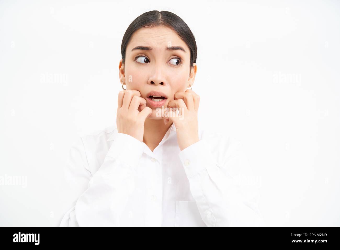 Portrait of asian businesswoman looks scared, stares terrified and ...